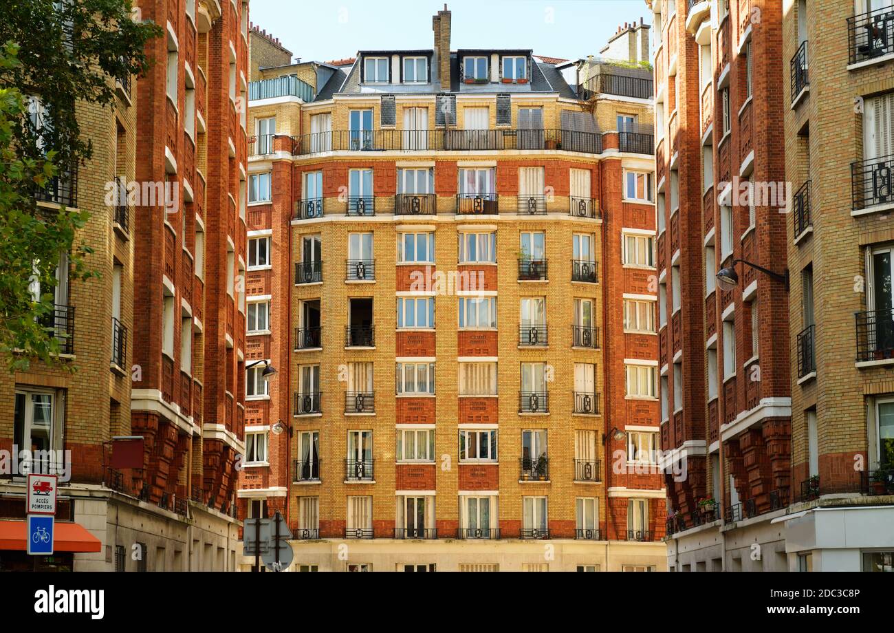 Facade of typical building, made with bi-color bricks, in Paris Stock ...