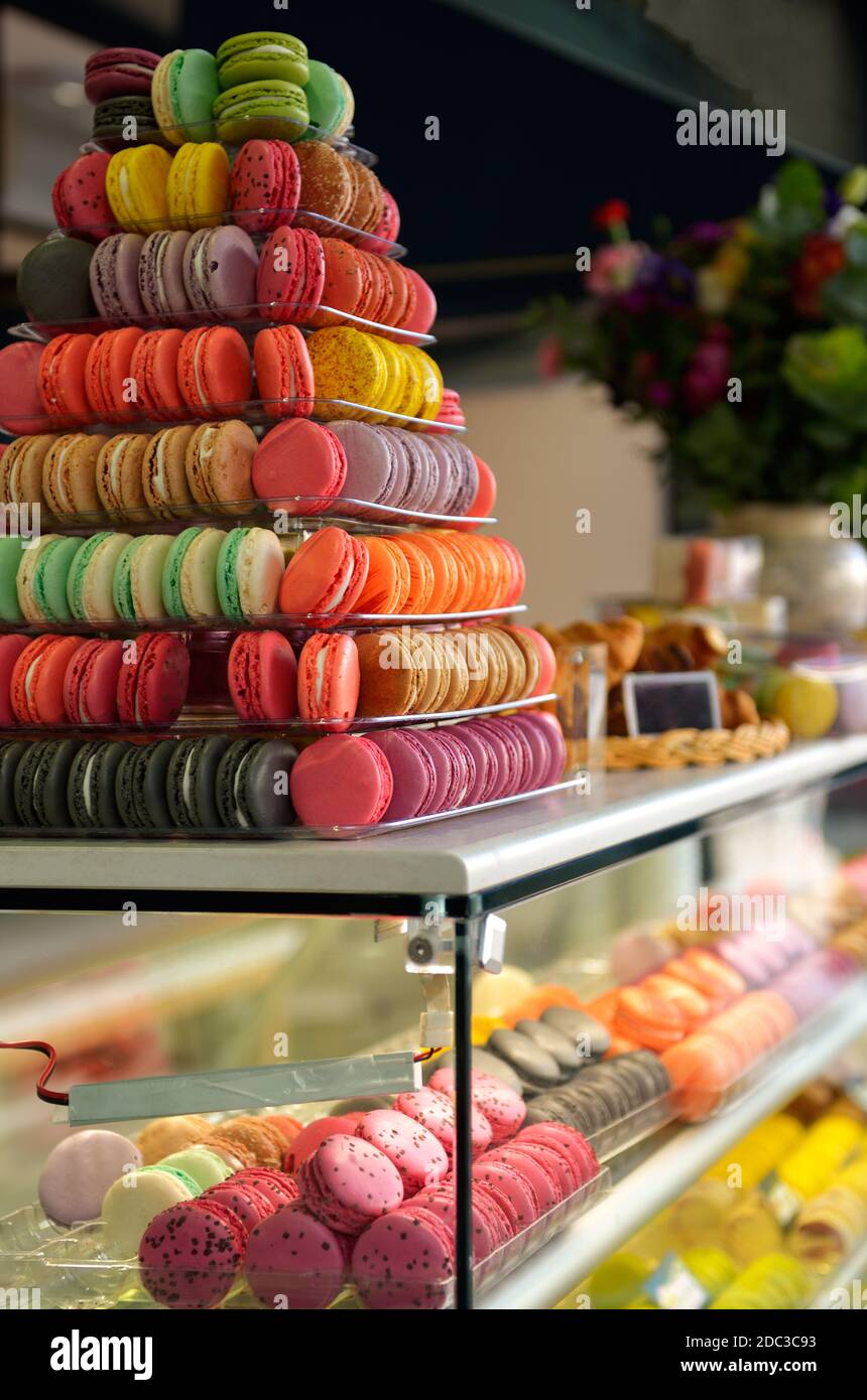 Pyramid made of colorful, French macaroons presented in street display ...