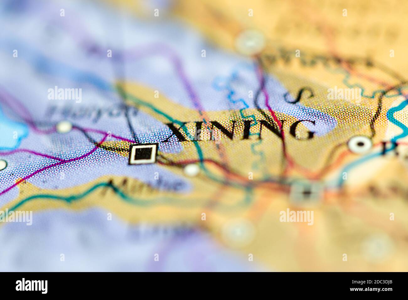 Shallow depth of field focus on geographical map location of Xining ...