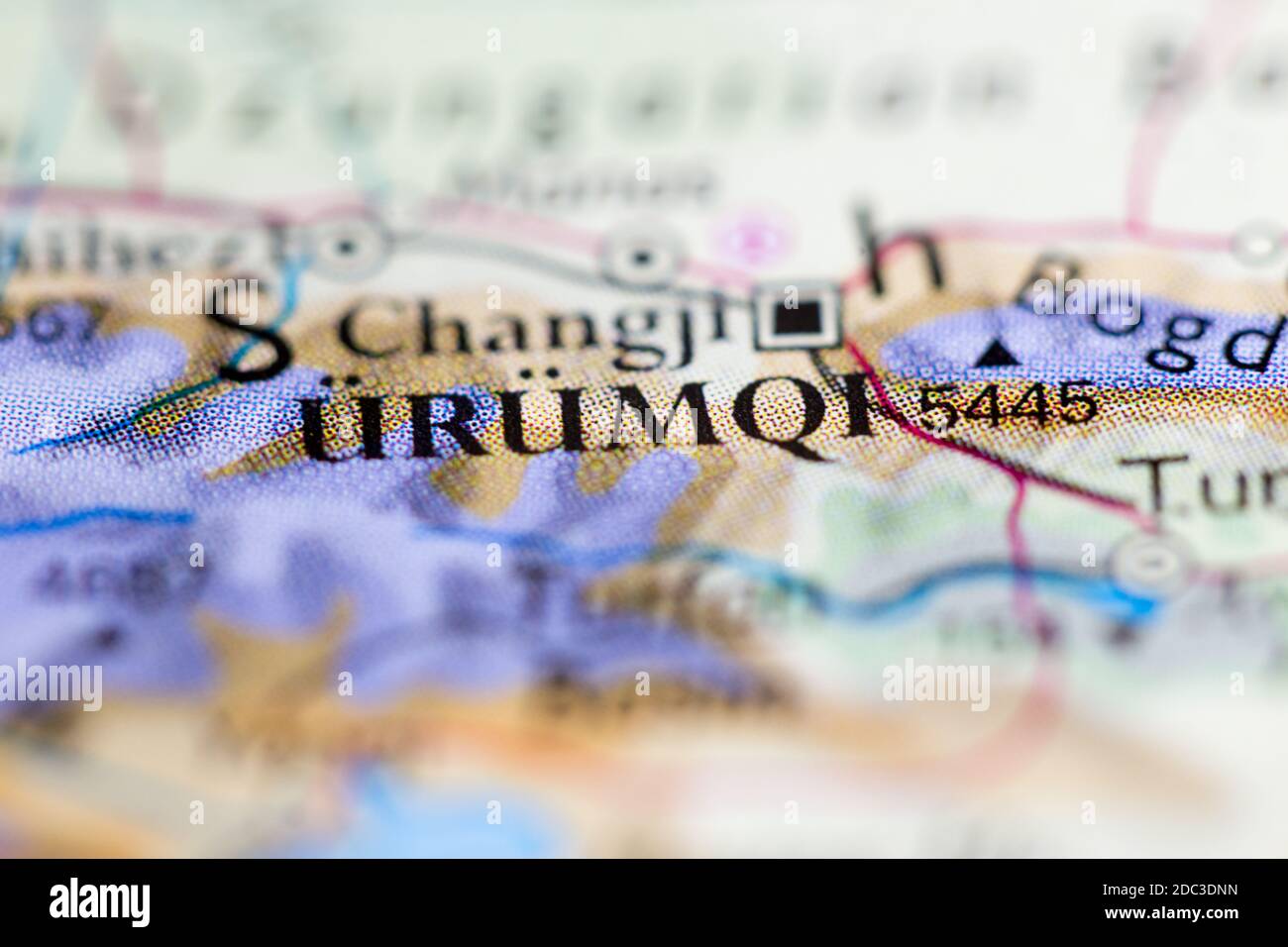 Shallow depth of field focus on geographical map location of Urumqi ...