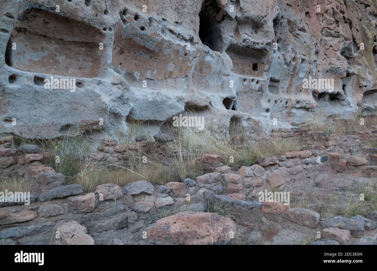 A foundation of brick and clay still stands where a tall building used ...