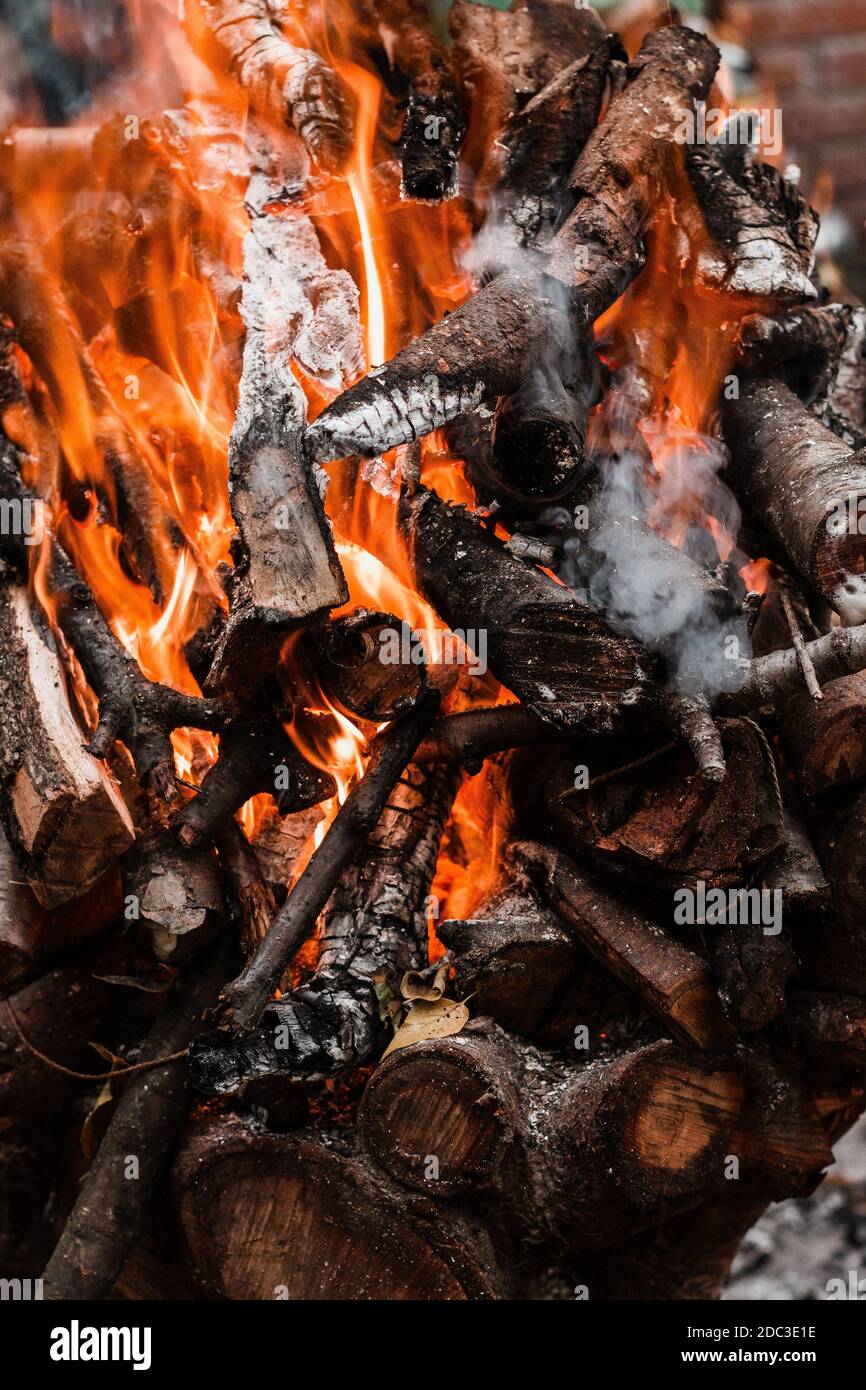 Fire burning tree branches, ember glowing Stock Photo - Alamy