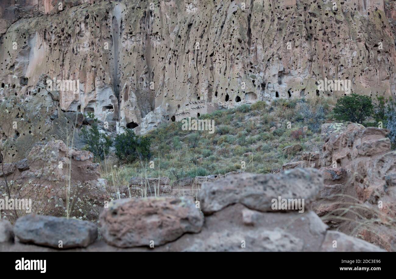 A building made of brick and clay with wooden poles to support a roof ...