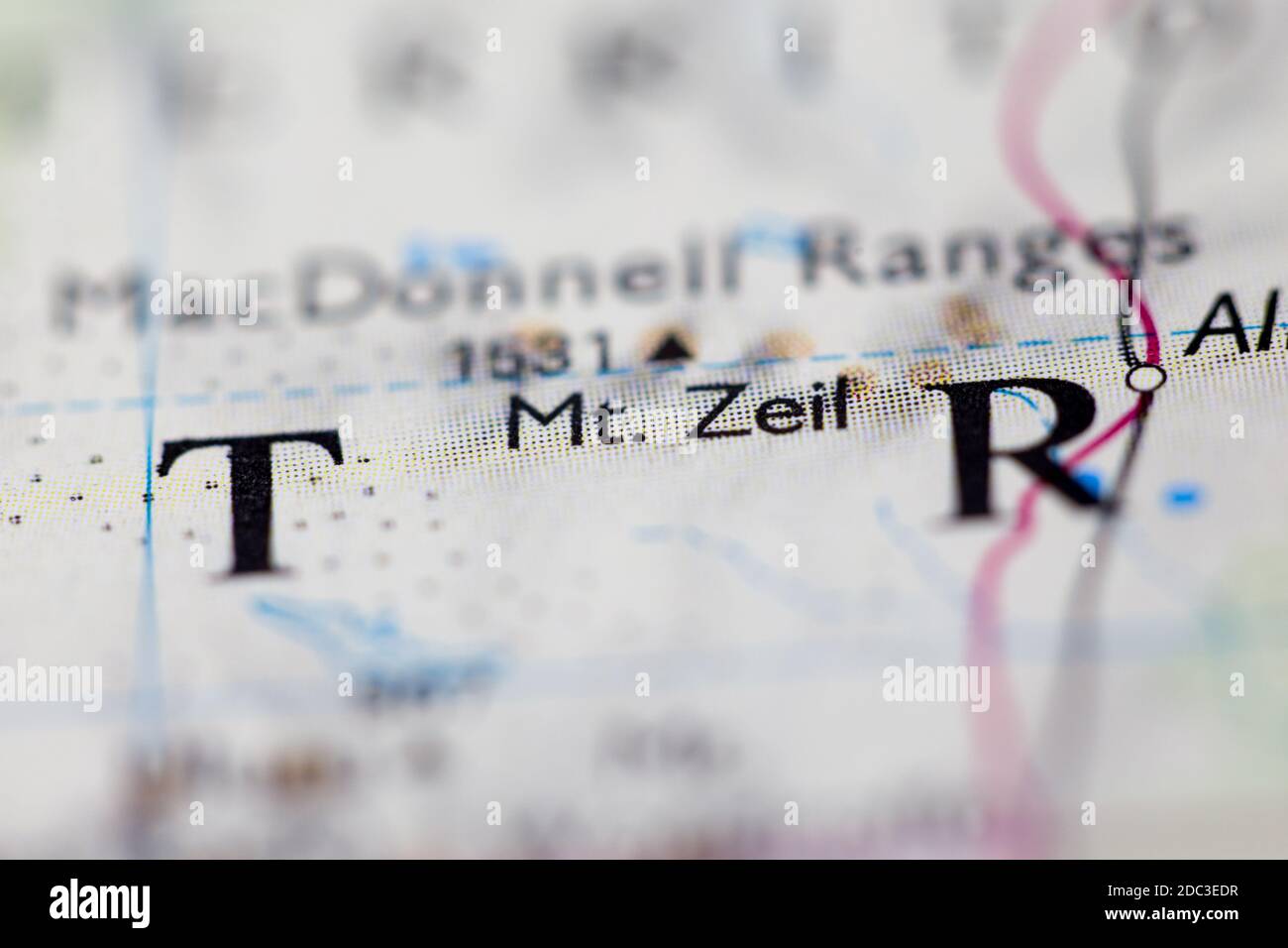 Shallow depth of field focus on geographical map location of Mount Zeil ...