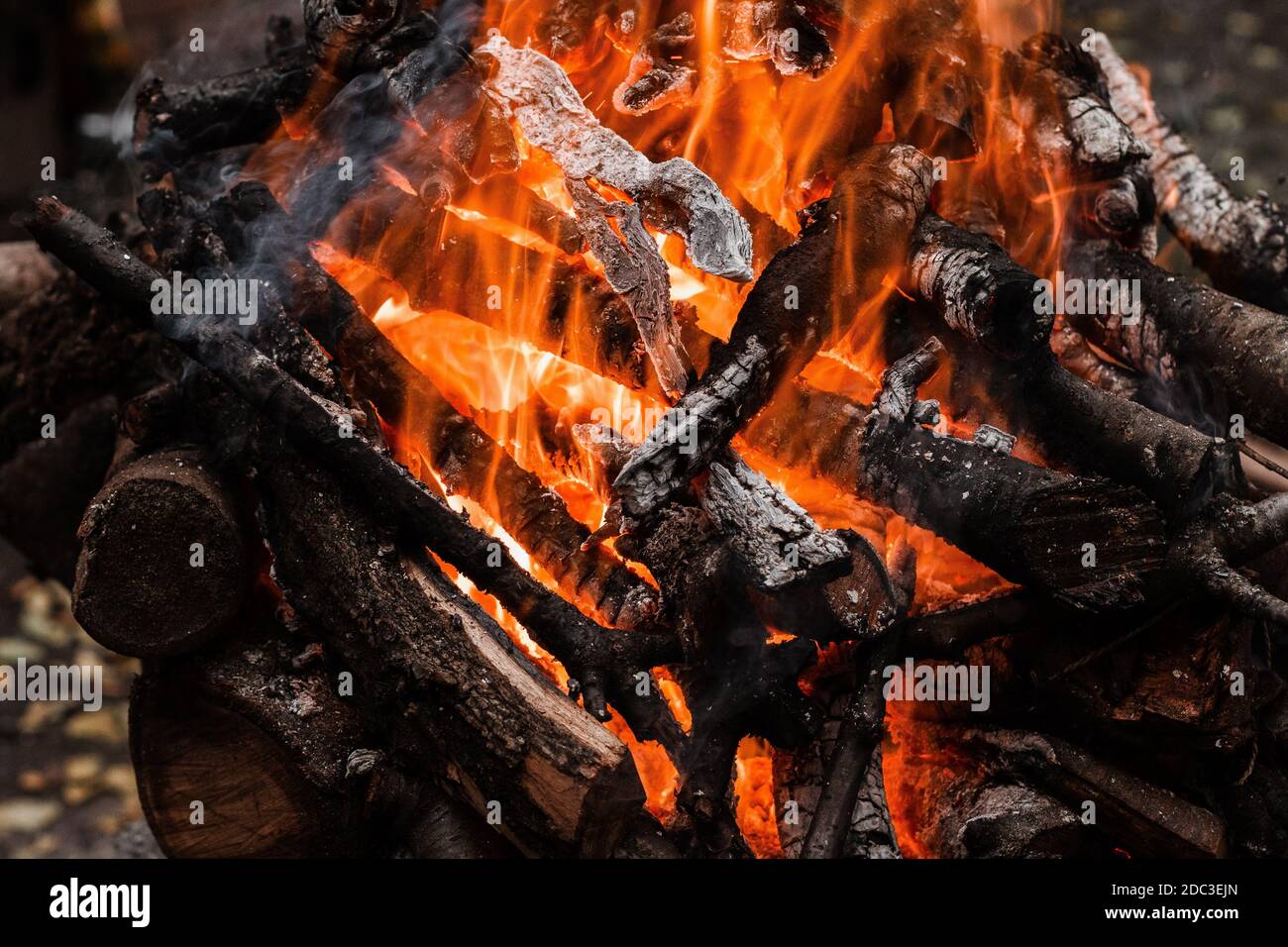 Fire burning tree branches, ember glowing Stock Photo - Alamy
