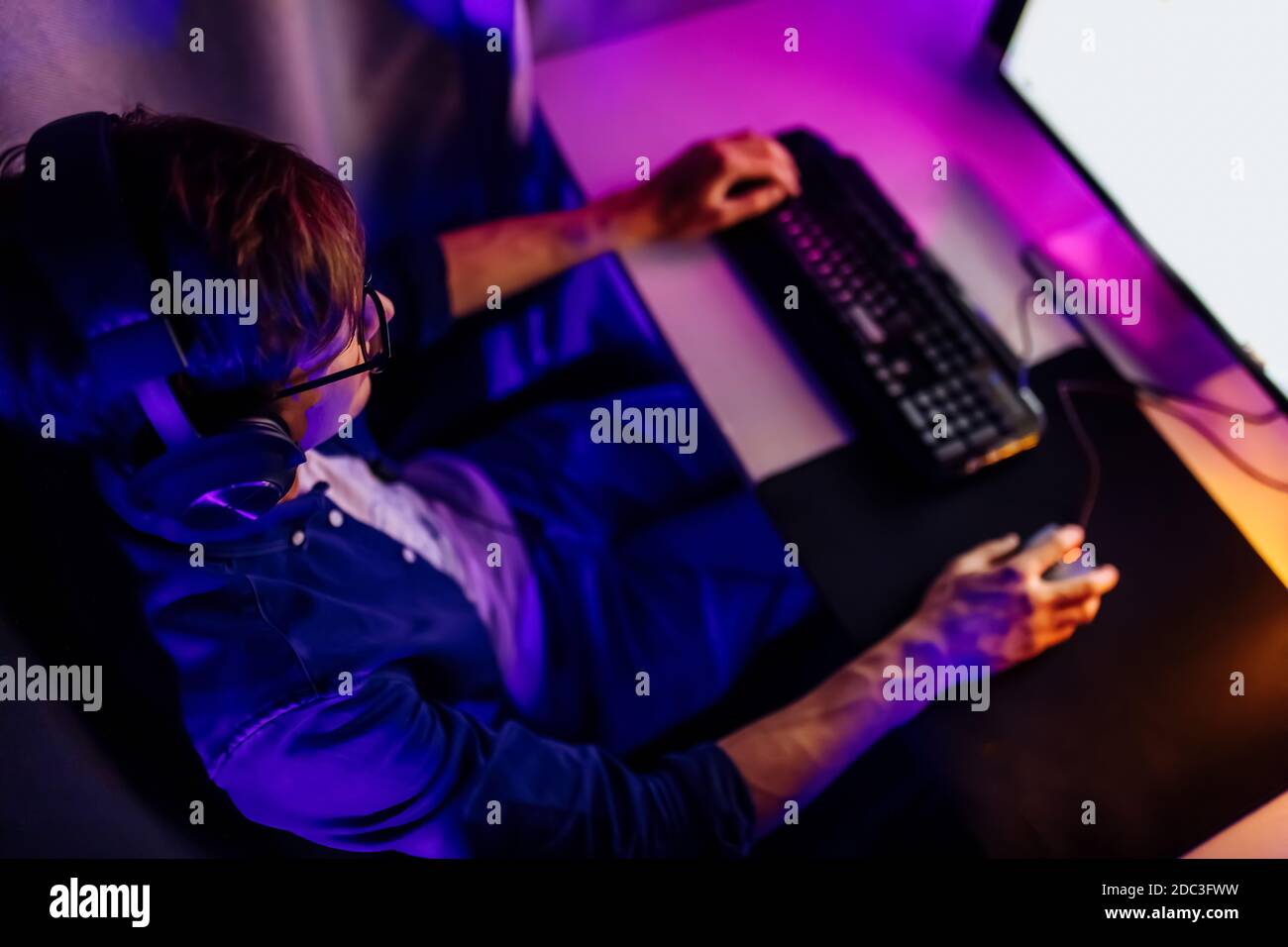 A professional gamer plays online video games in the first person on ...