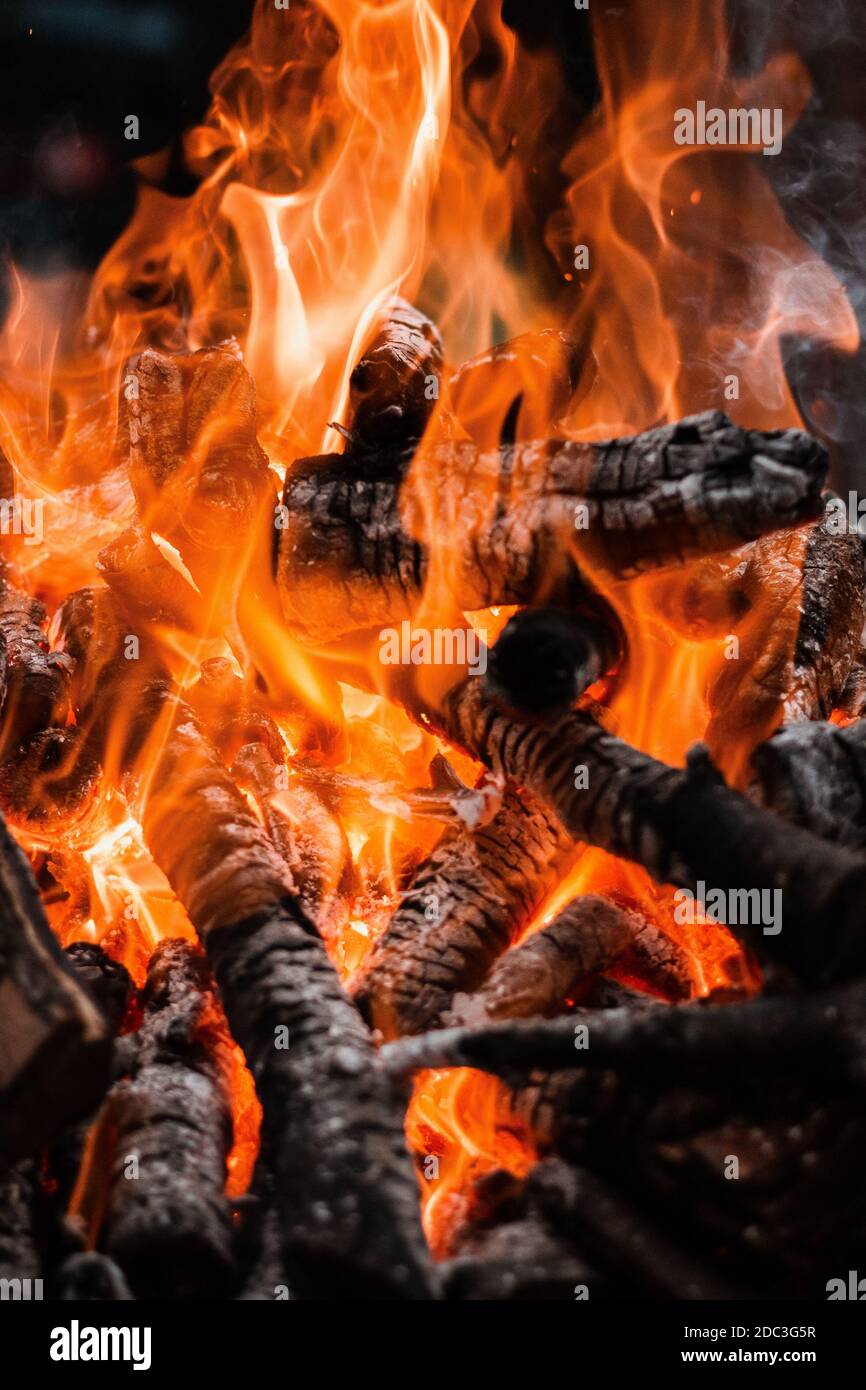 Fire burning tree branches, ember glowing Stock Photo - Alamy