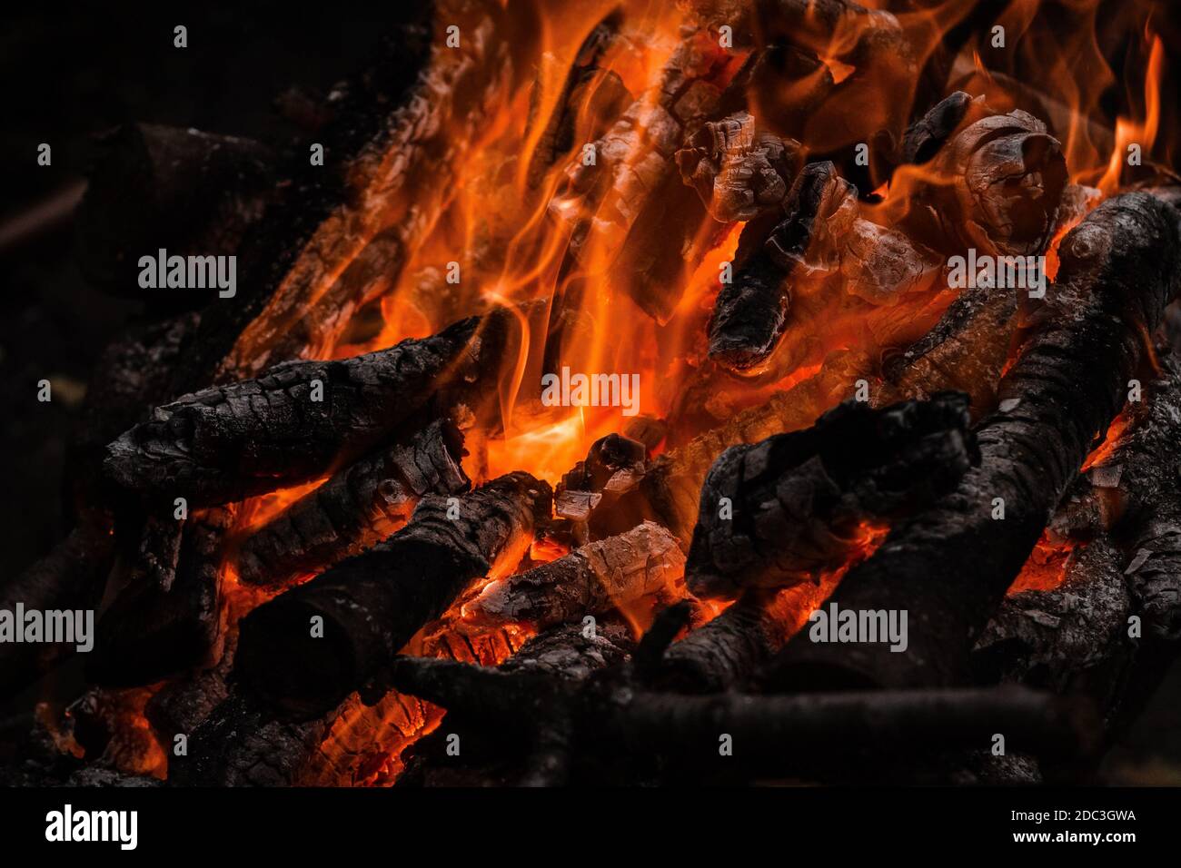 Fire burning tree branches, ember glowing Stock Photo - Alamy
