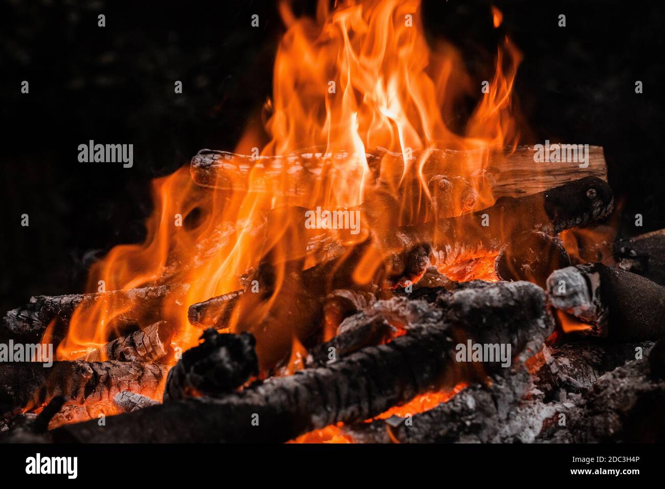 Fire burning tree branches, ember glowing Stock Photo - Alamy