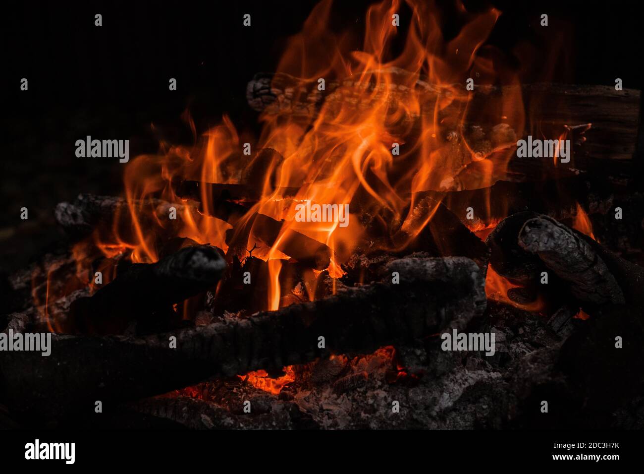 Fire burning tree branches, ember glowing Stock Photo - Alamy