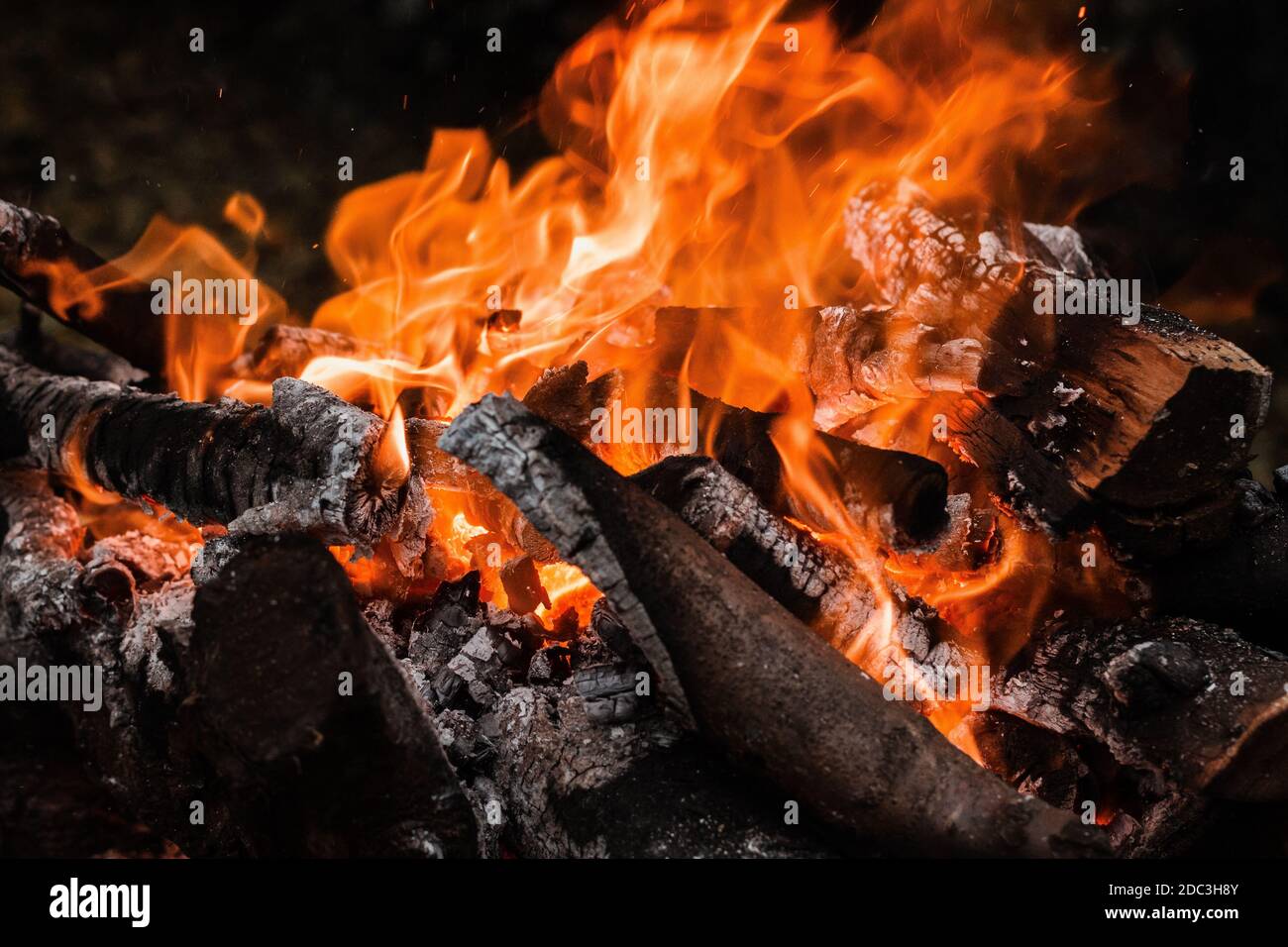 Fire burning tree branches, ember glowing Stock Photo - Alamy