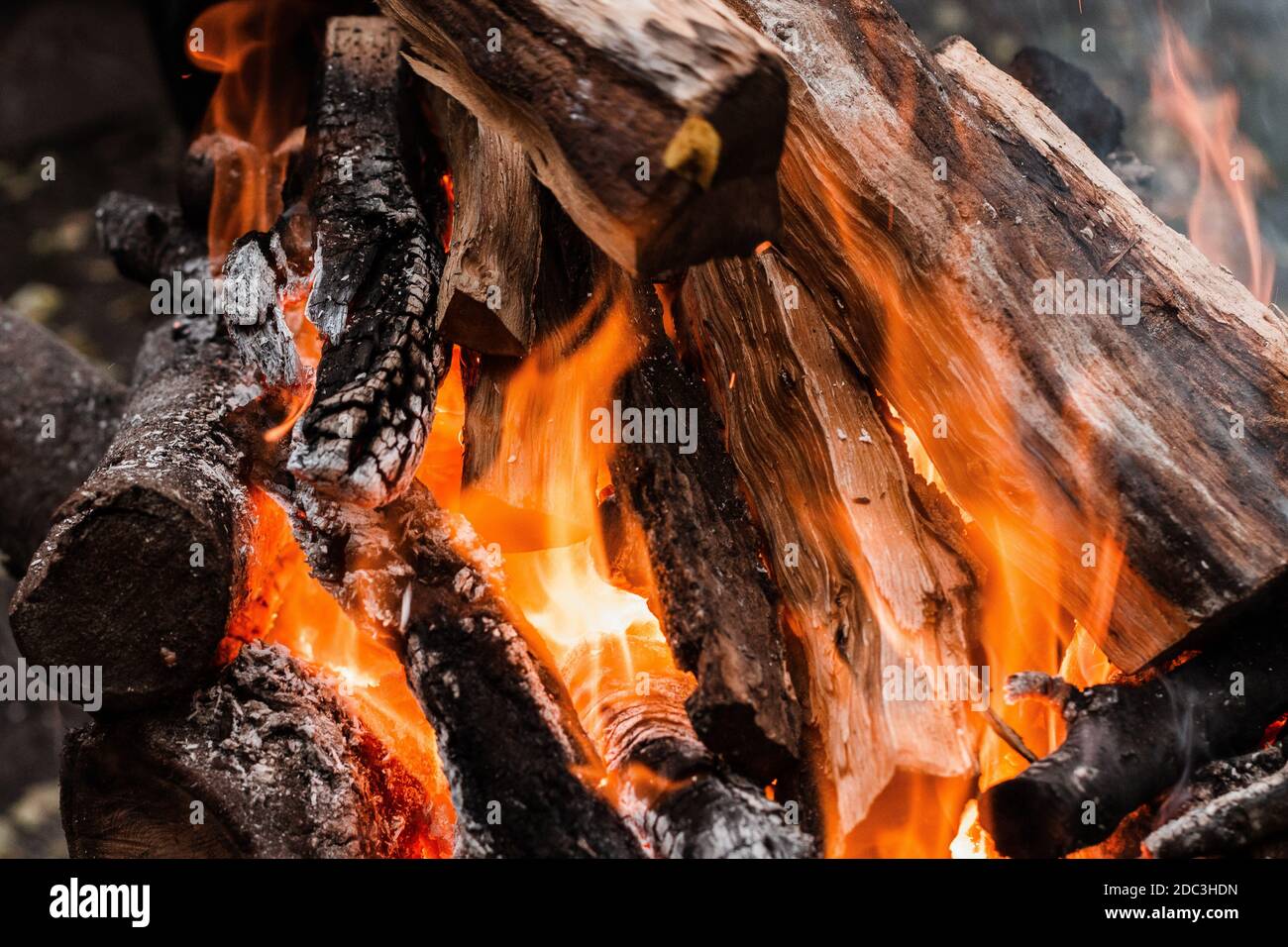 Fire burning tree branches, ember glowing Stock Photo - Alamy