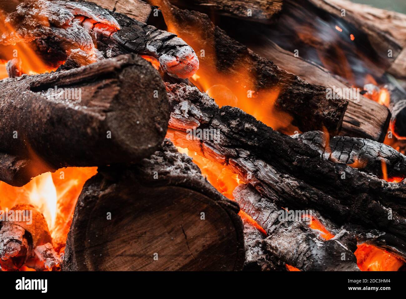 Fire burning tree branches, ember glowing Stock Photo - Alamy