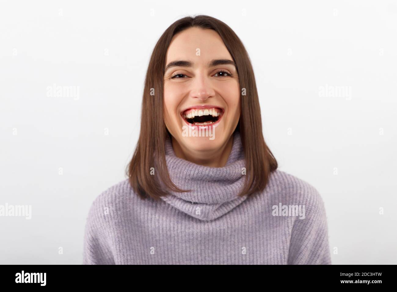 Happy Cheerful Young Woman Wearing Her Brunet Hair Rejoicing At