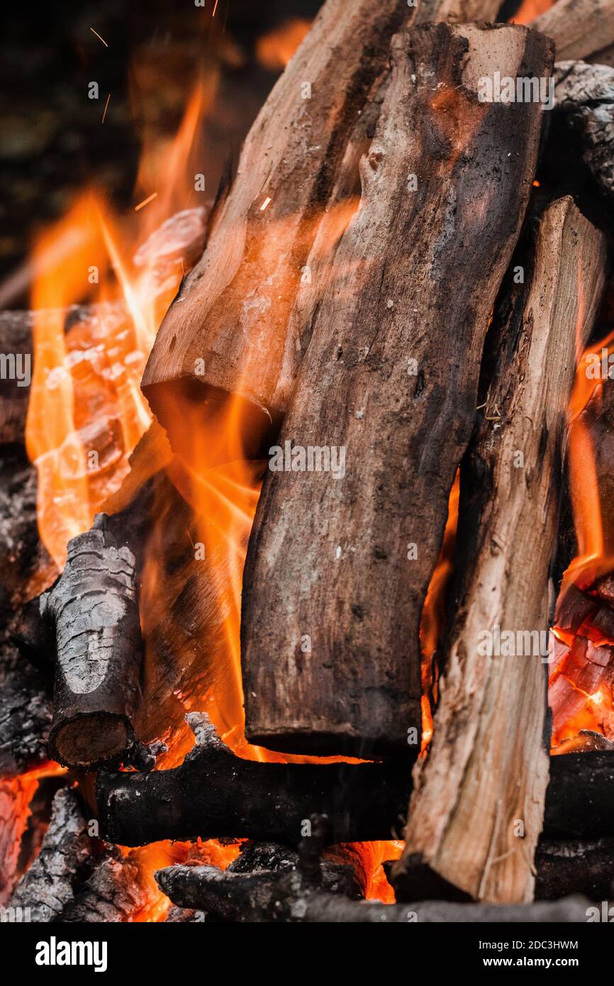 Fire burning tree branches, ember glowing Stock Photo - Alamy