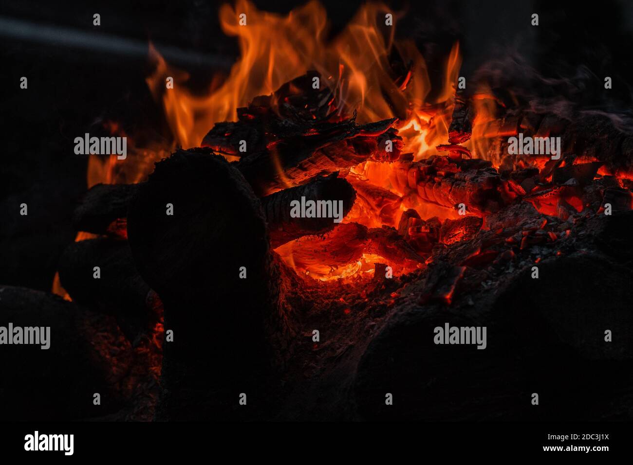 Fire burning tree branches, ember glowing Stock Photo - Alamy