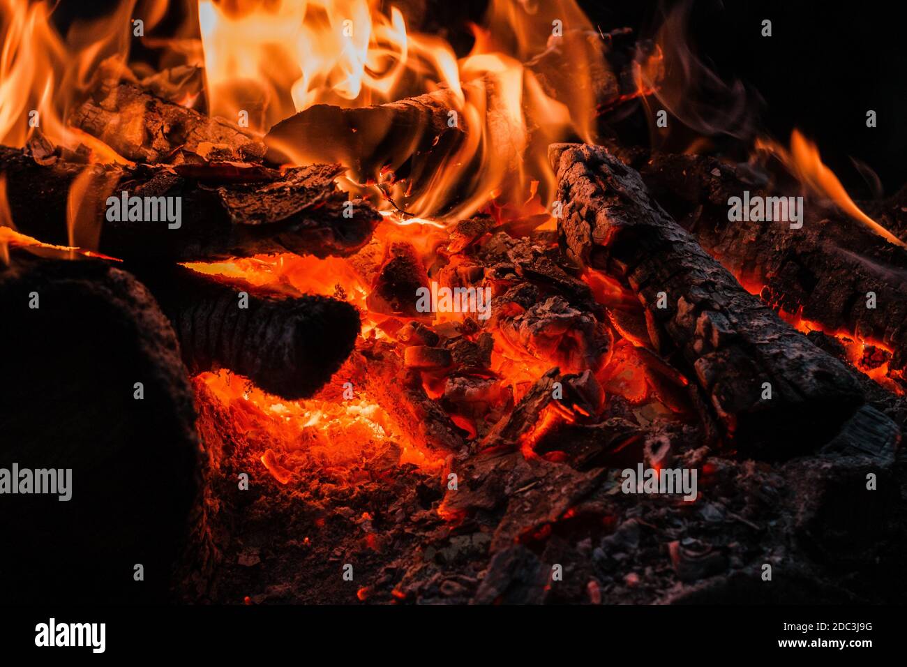Fire burning tree branches, ember glowing Stock Photo - Alamy