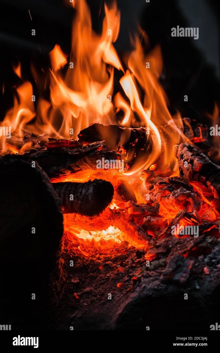 Fire burning tree branches, ember glowing Stock Photo - Alamy