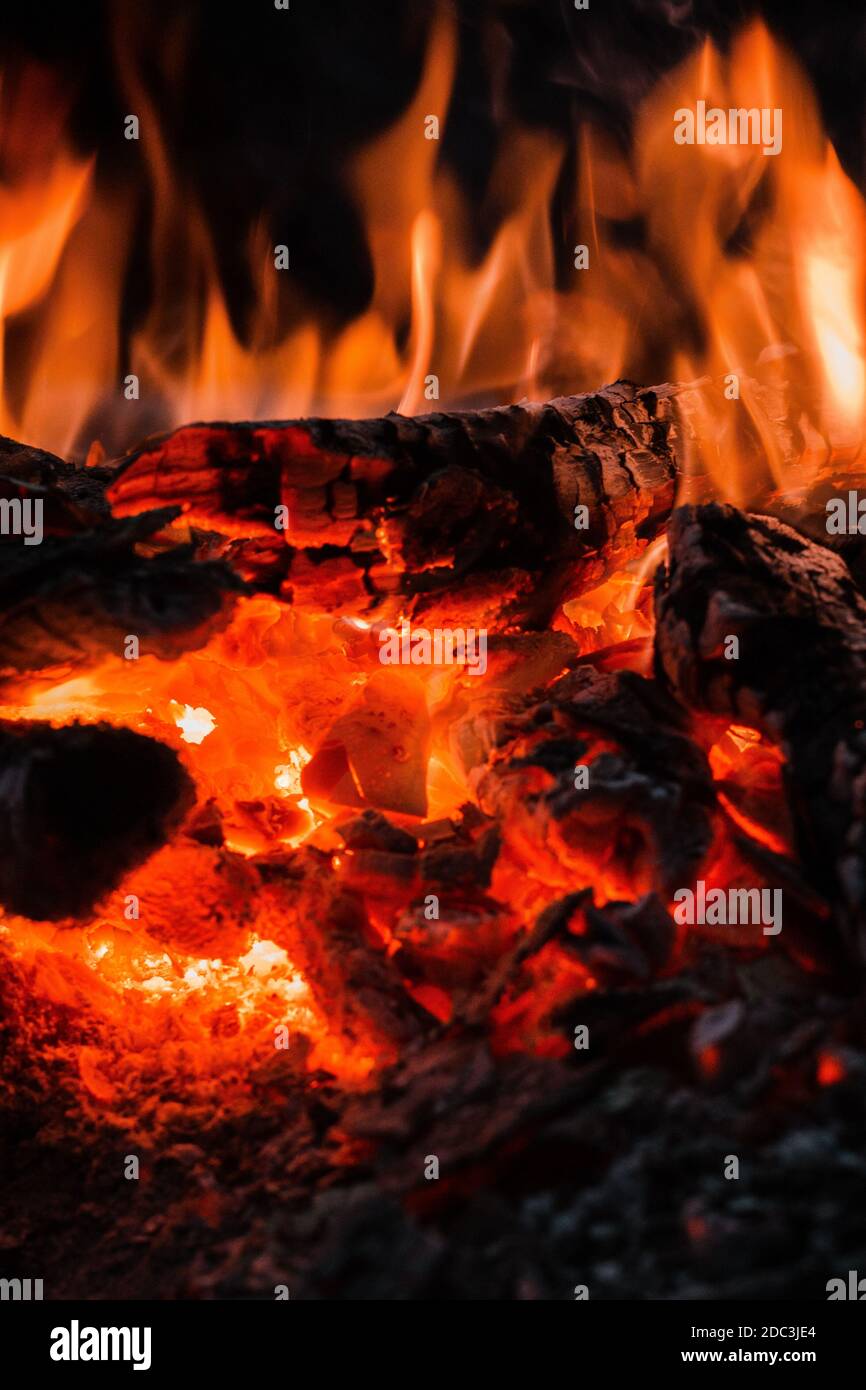 Fire burning tree branches, ember glowing Stock Photo - Alamy