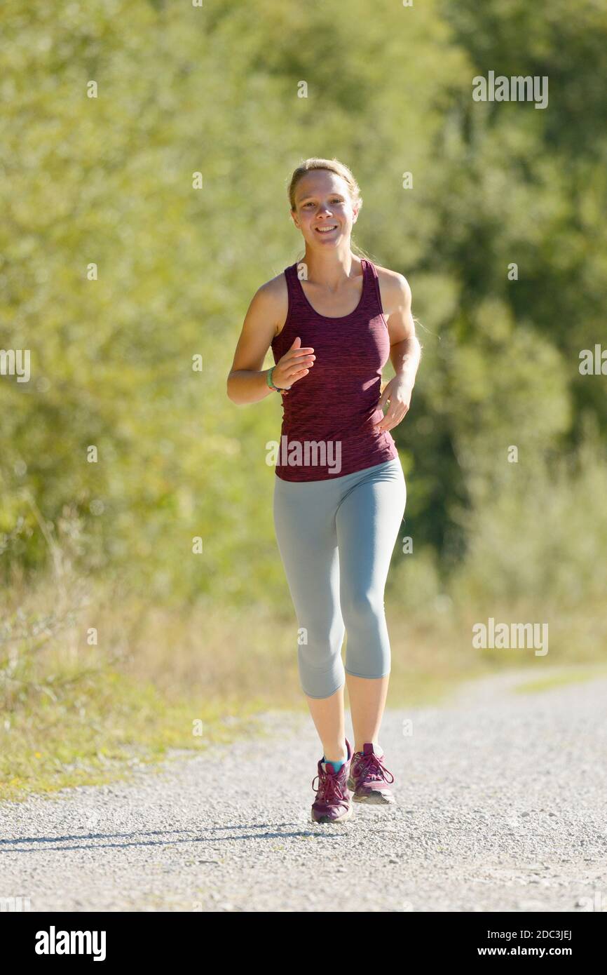Young people running in late hi-res stock photography and images - Alamy