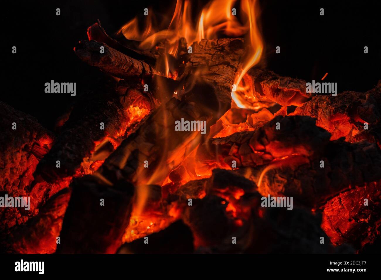 Fire burning tree branches, ember glowing Stock Photo - Alamy