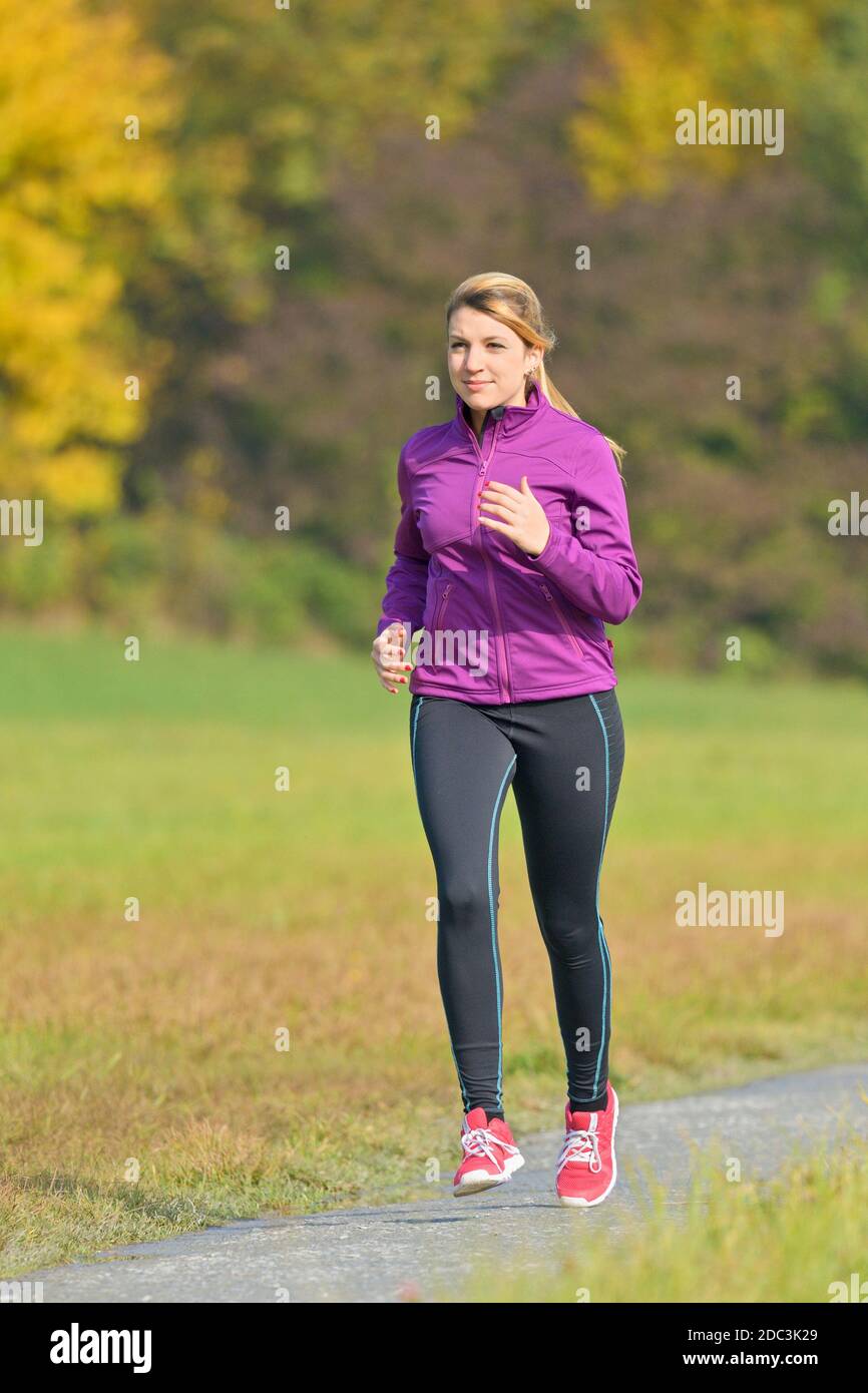 Woman jogging in leggins hi-res stock photography and images - Alamy