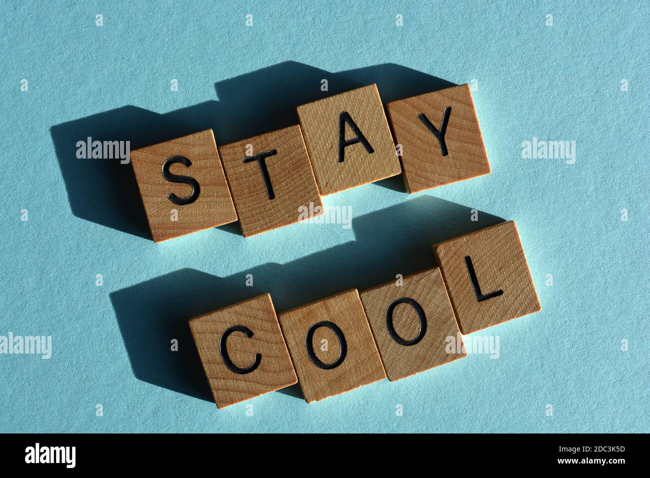 Stay Cool, words in wooden alphabet letters isolated on blue background ...