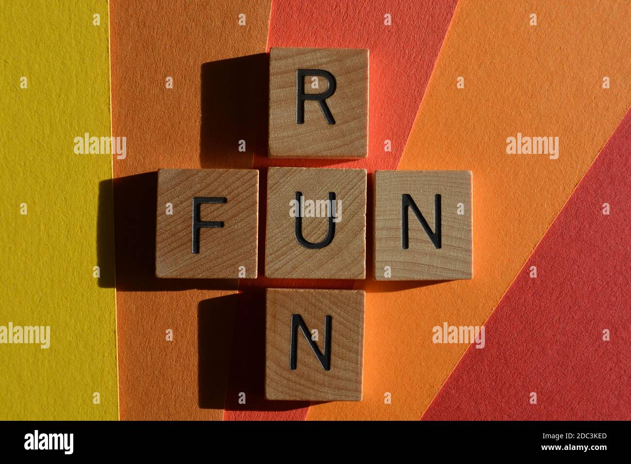 Fun, Run, words in wooden alphabet letters in crossword form isolated ...