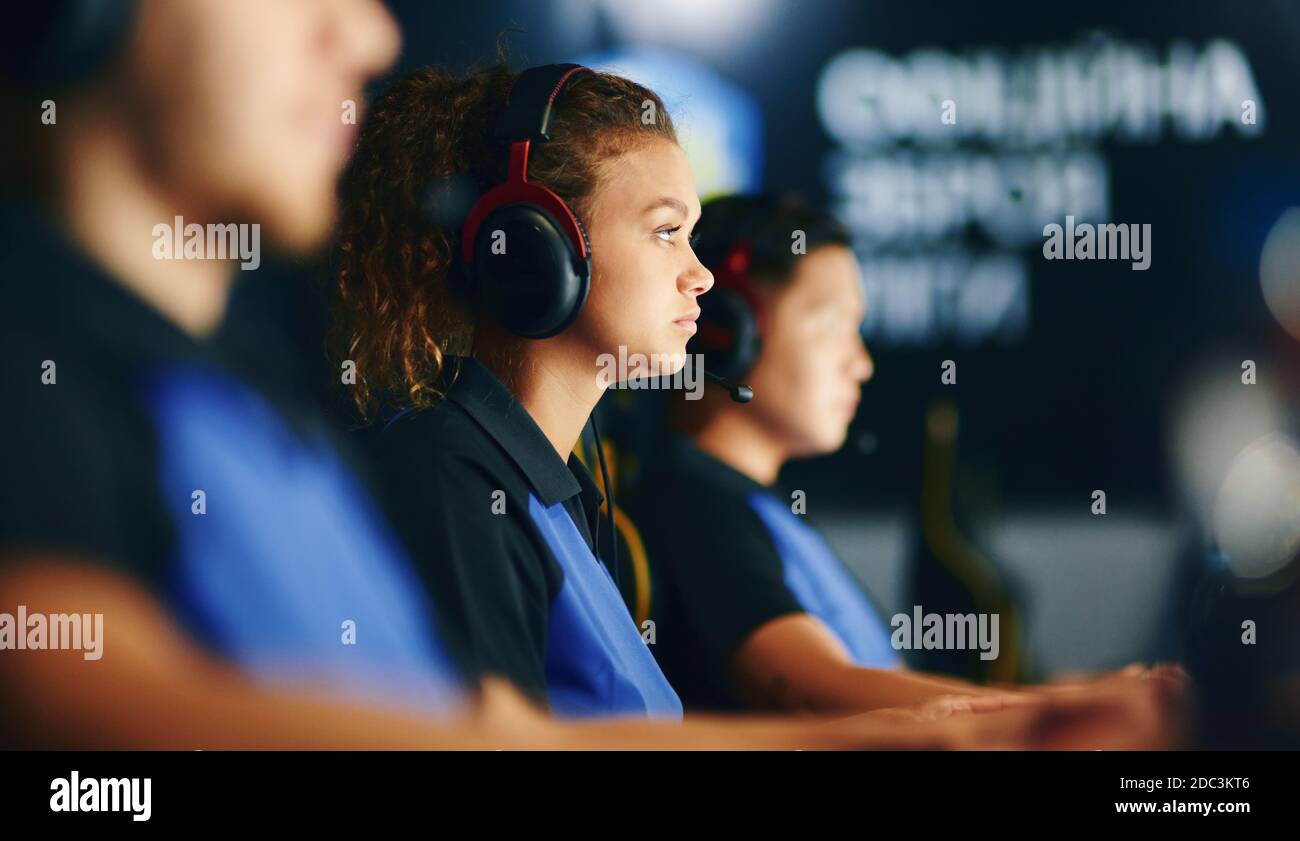 Play to win. Side view of a focused mixed race girl, female cybersport ...