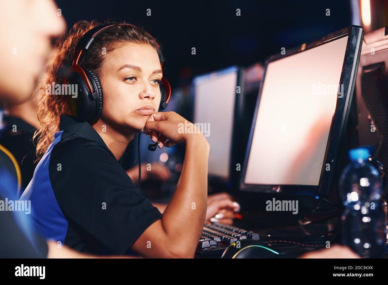 Failure. Side view of a upset mixed race girl, female cybersport gamer ...