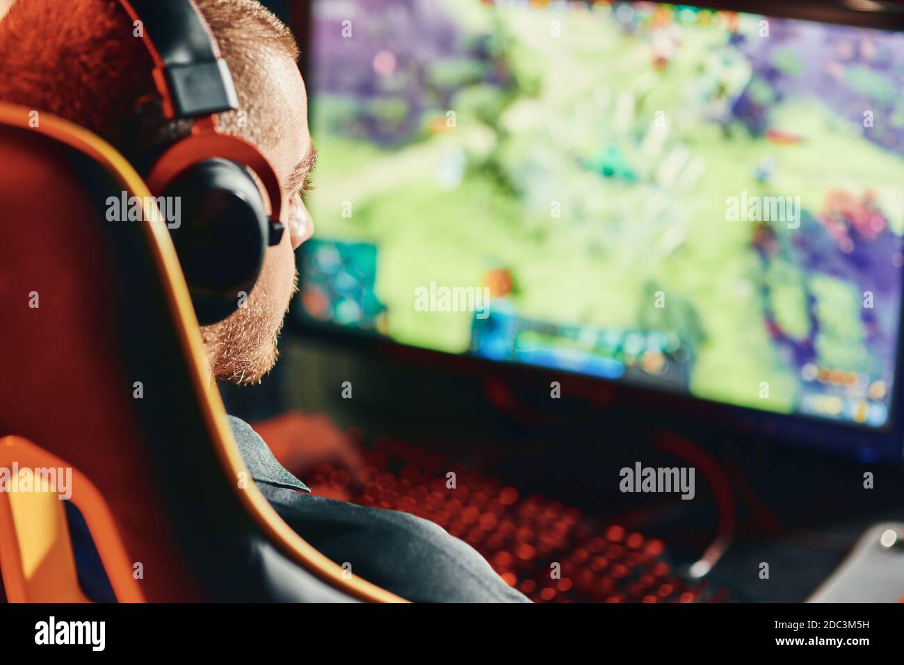 Close up shot of a professional male cybersport gamer wearing ...