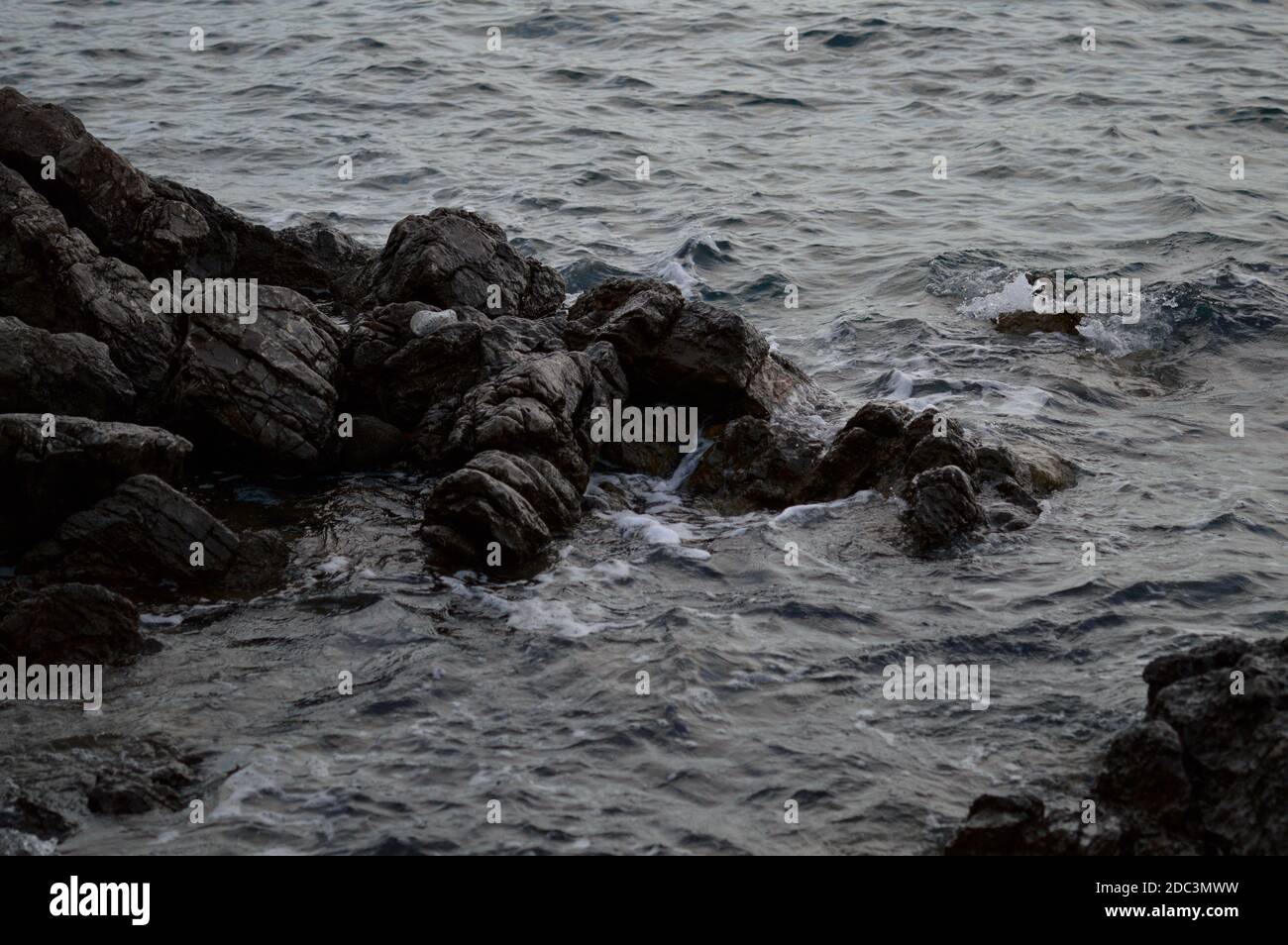 Sea waves crashing into rocks. Storm at the sea, dark, moody photo ...