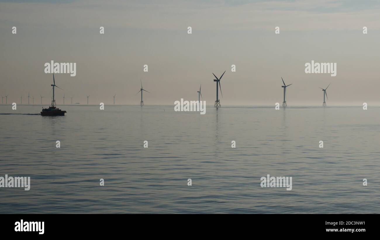 Wind turbines in offshore wind farm in German north sea with crew ...