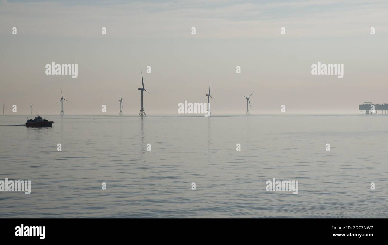 Wind turbines in offshore wind farm in German north sea with crew ...