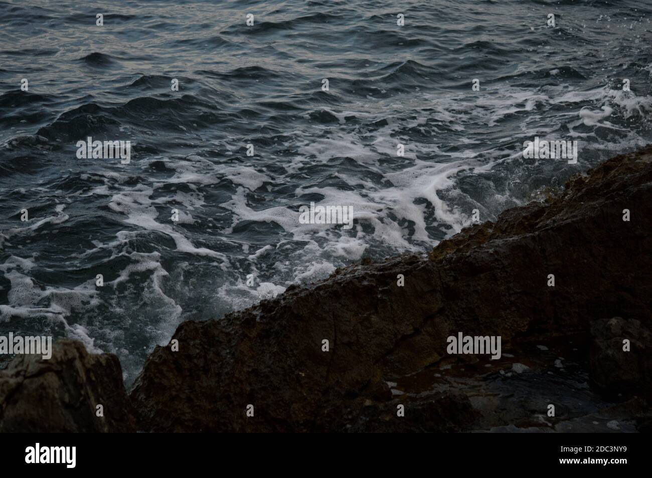 Sea waves crashing into rocks.Sea waves crashing into rocks. Storm at ...