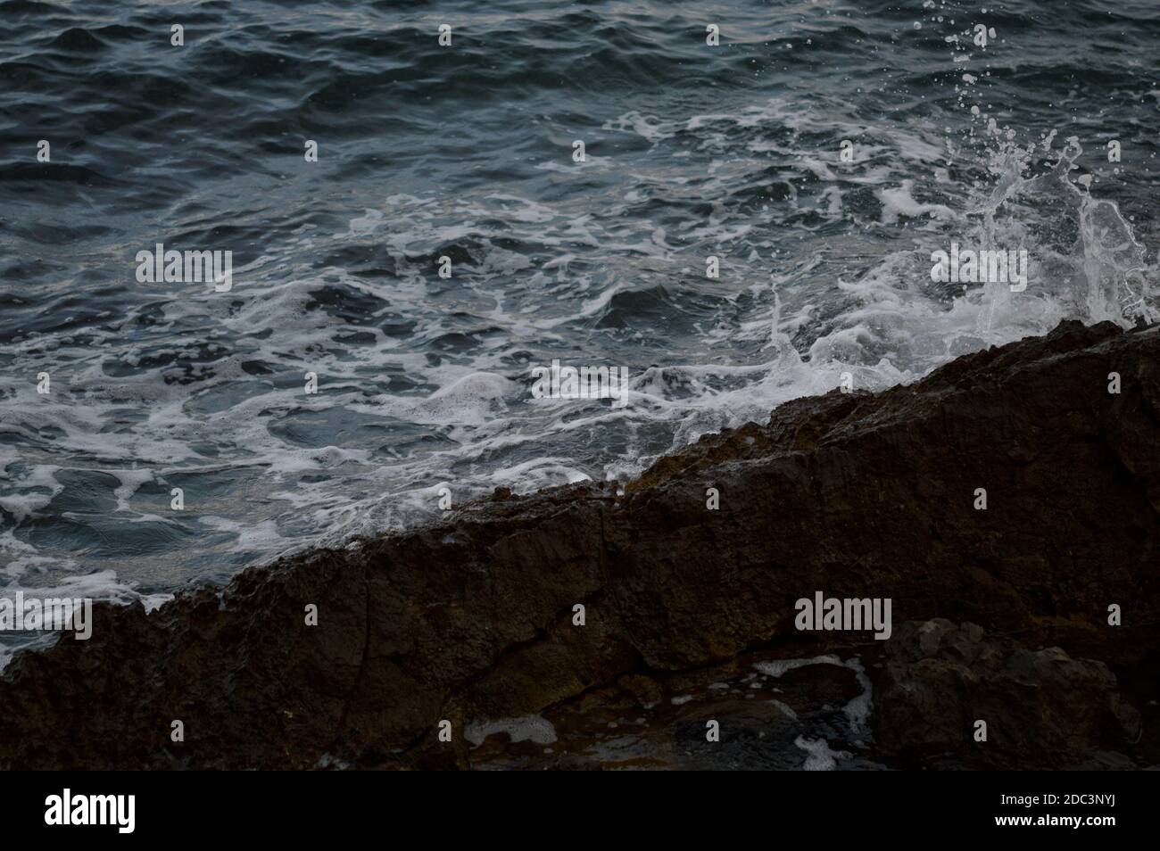 Sea waves crashing into rocks.Sea waves crashing into rocks. Storm at ...