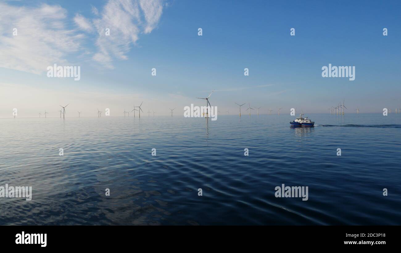 Offshore wind farm wind trubines with CTV in German north sea during ...