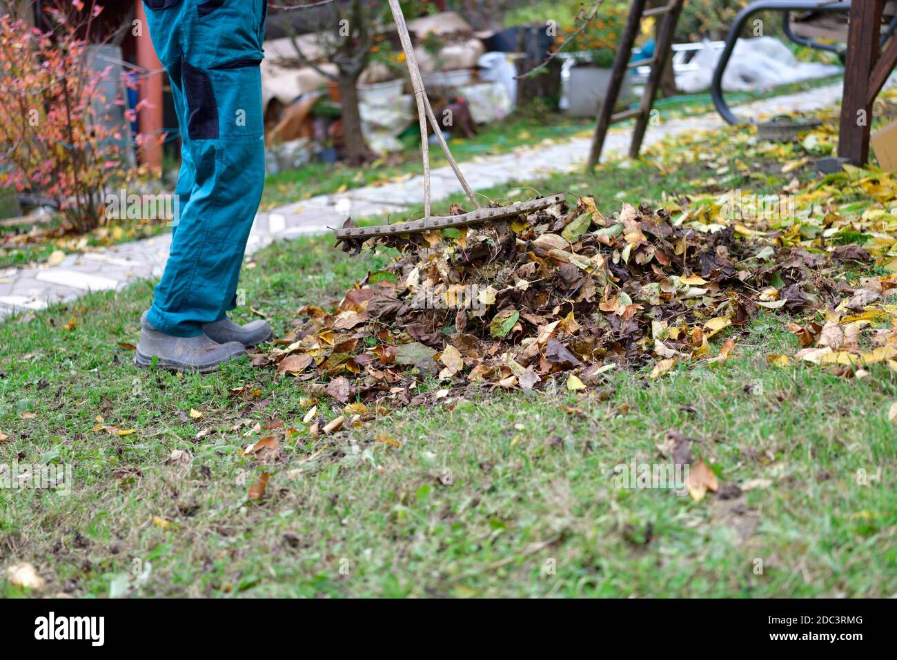 Farmer raking leaves in hi-res stock photography and images - Alamy