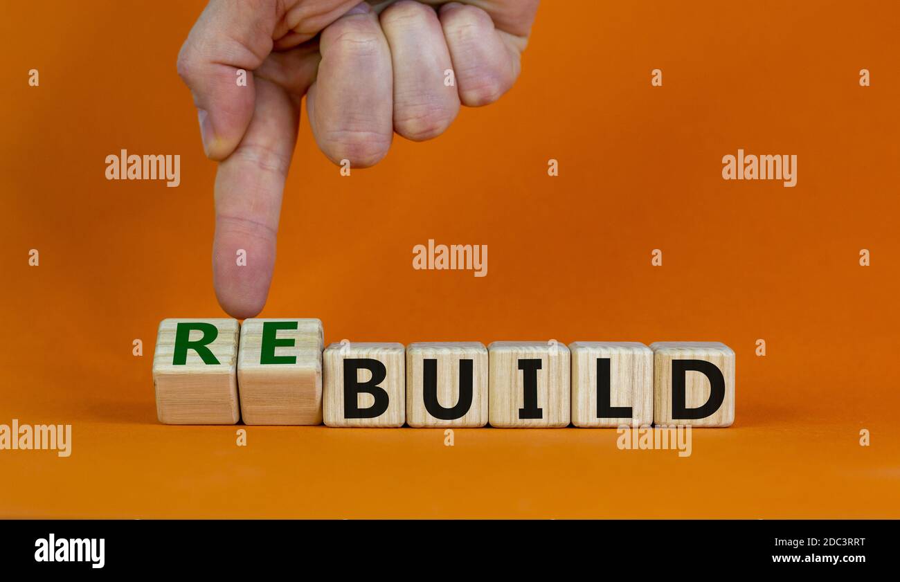Time to rebuild. Concept words 'build' and 'rebuild' on cubes on a ...