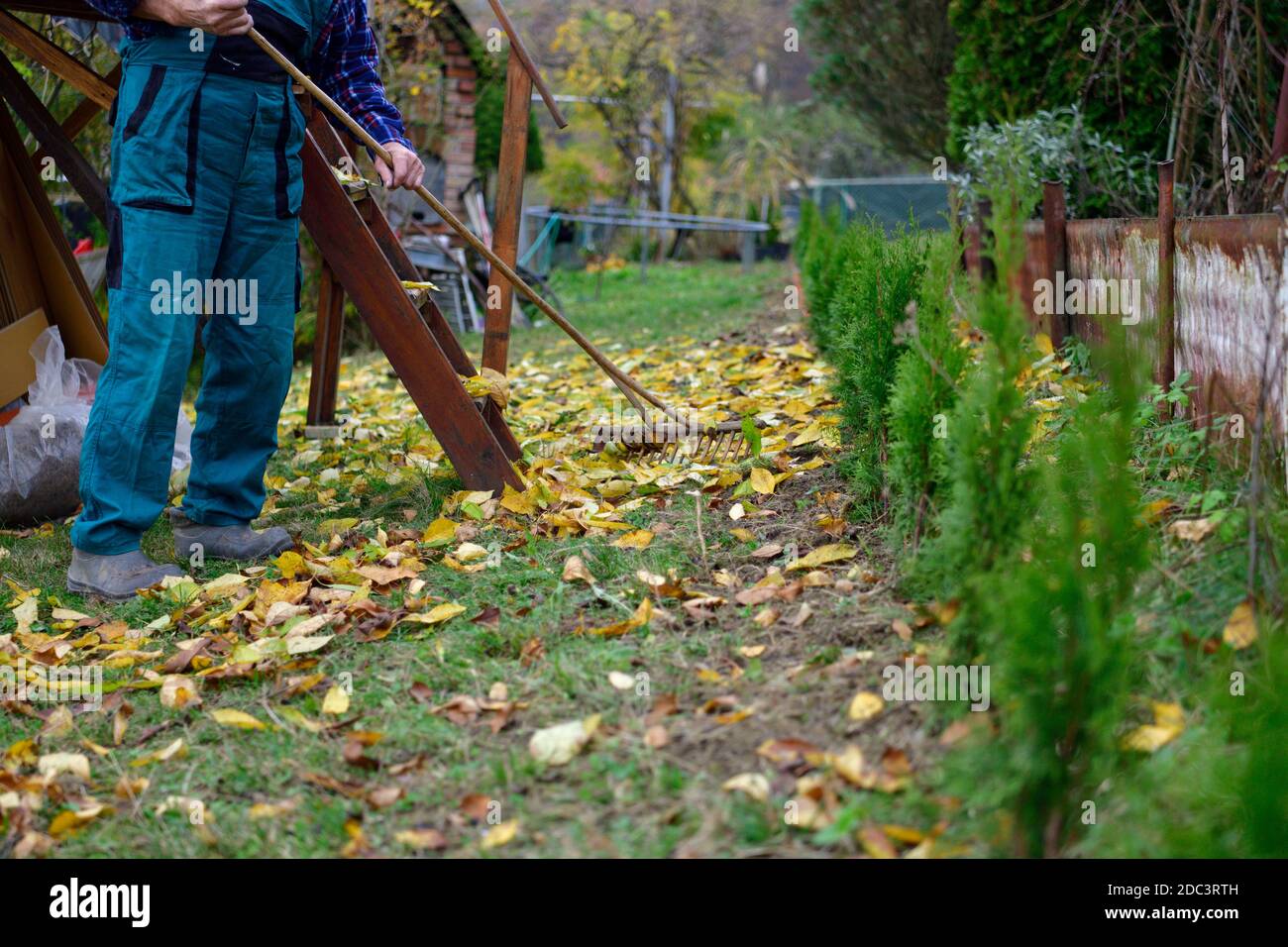 Farmer raking leaves in hi-res stock photography and images - Alamy