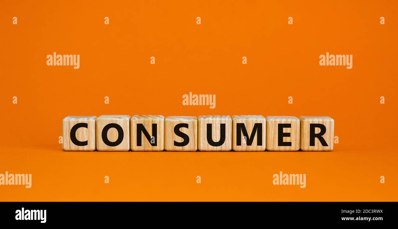 Concept word 'consumer' on cubes on a beautiful orange background ...