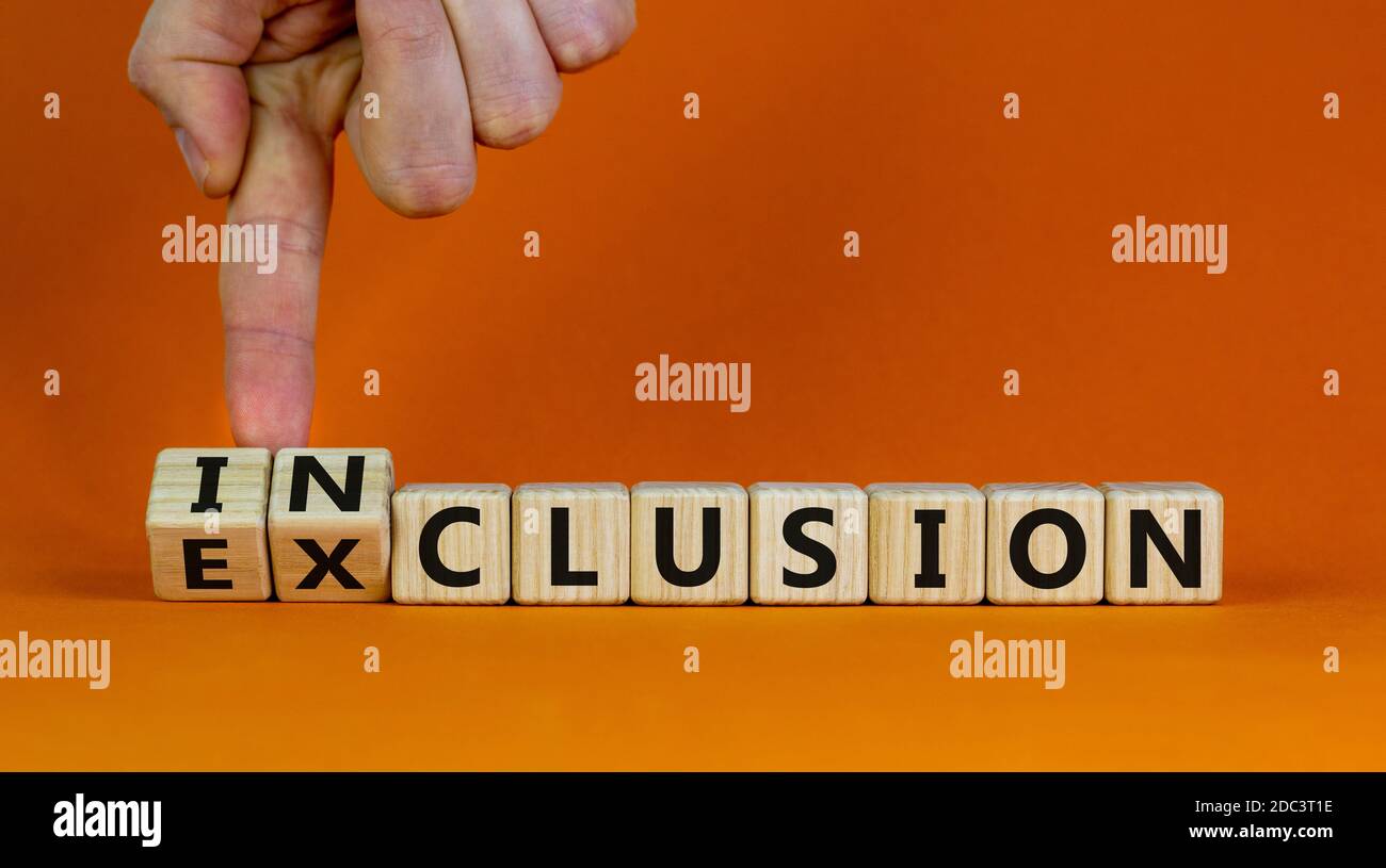 Symbol for a better inclusion. Hand turns cubes and changes the word ...