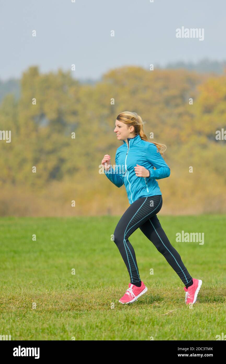 Woman jogging side face hi-res stock photography and images - Alamy