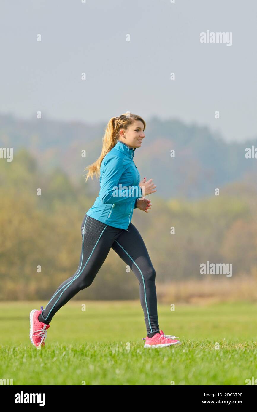 Woman jogging side face hi-res stock photography and images - Alamy
