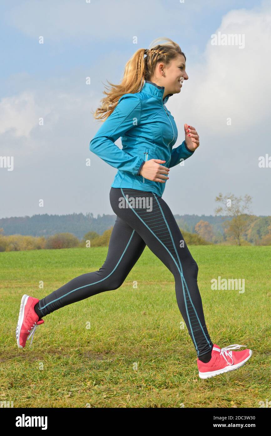 Woman jogging side face hi-res stock photography and images - Alamy