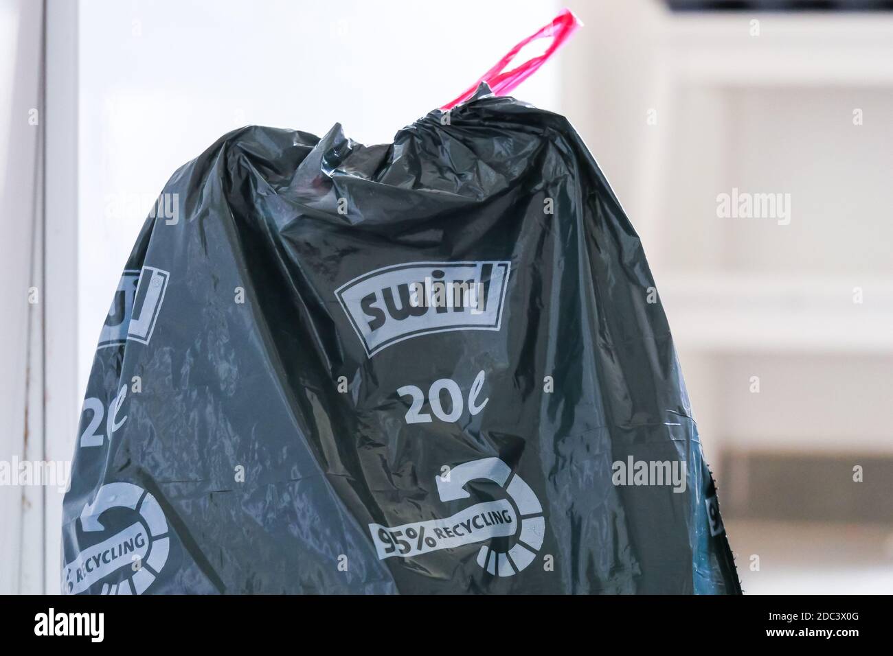 Swirl brand black recyclable black garbage bag. Medium shot Stock Photo ...