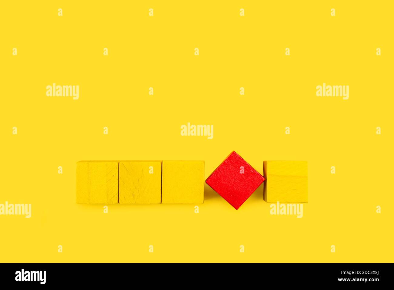 Yellow and red square wooden blocks on a yellow background Stock Photo ...