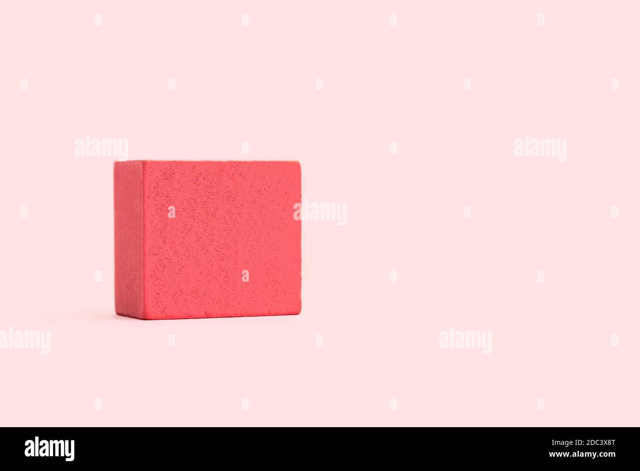 A pink wooden block on a pink background with copy space Stock Photo ...