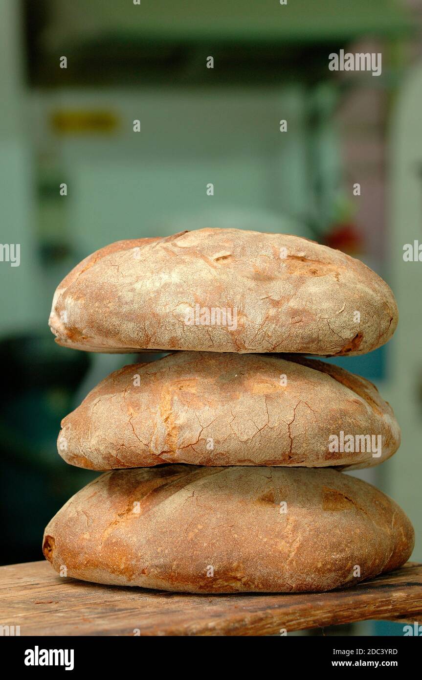 three stacked shapes of typical Apulian DOP durum wheat bread from ...