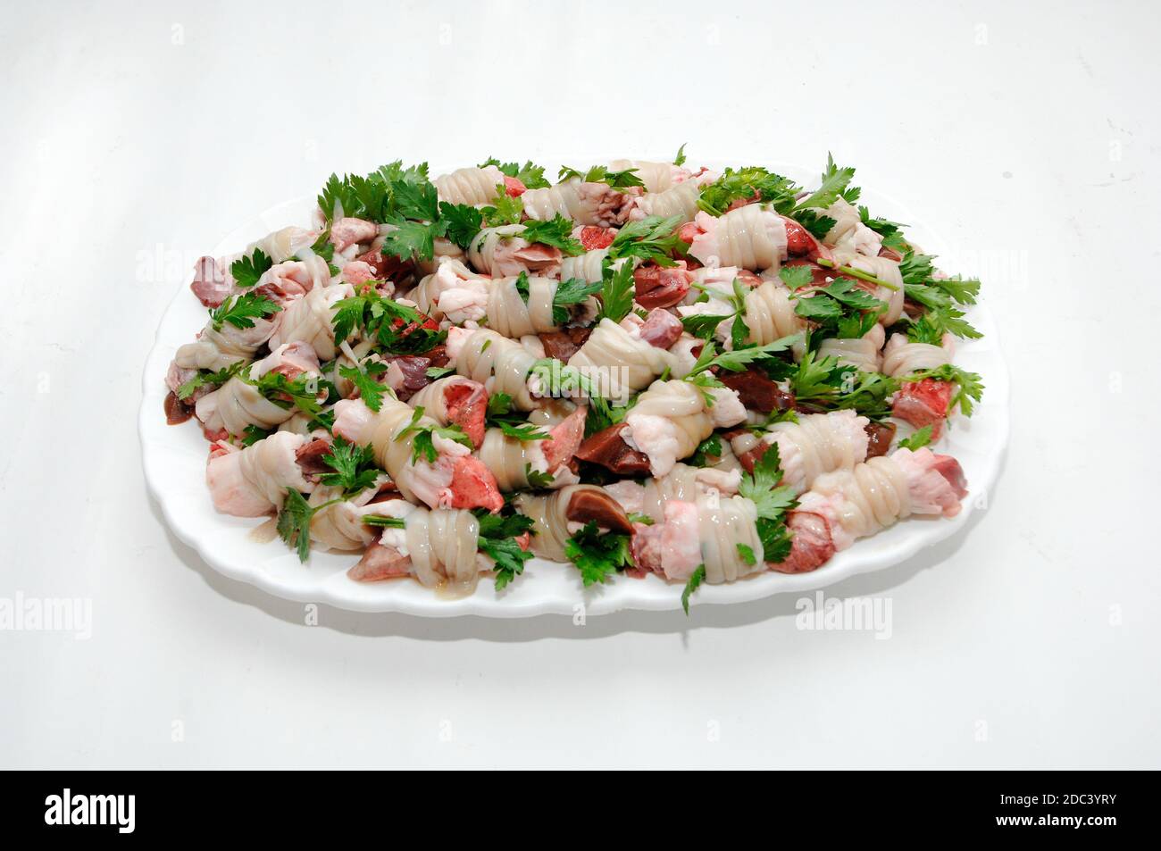 typical dish of the Puglia region in southern Italy called Gnemeridde ...